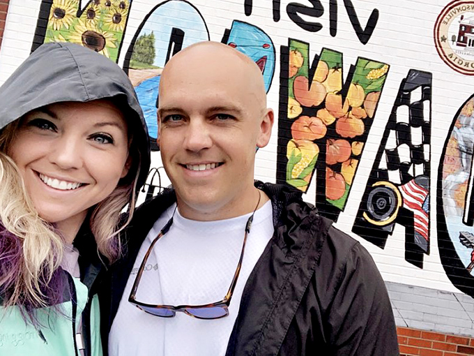 Even with no faces visible, you can sense the visitor's excitement standing before Dawsonville's colorful welcome sign&mdash;racing heritage transformed into public art.