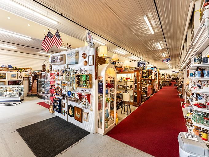American flags and vintage signage mark the entrance to a wonderland of collectibles, where the red carpet leads to discoveries you didn't know you needed.