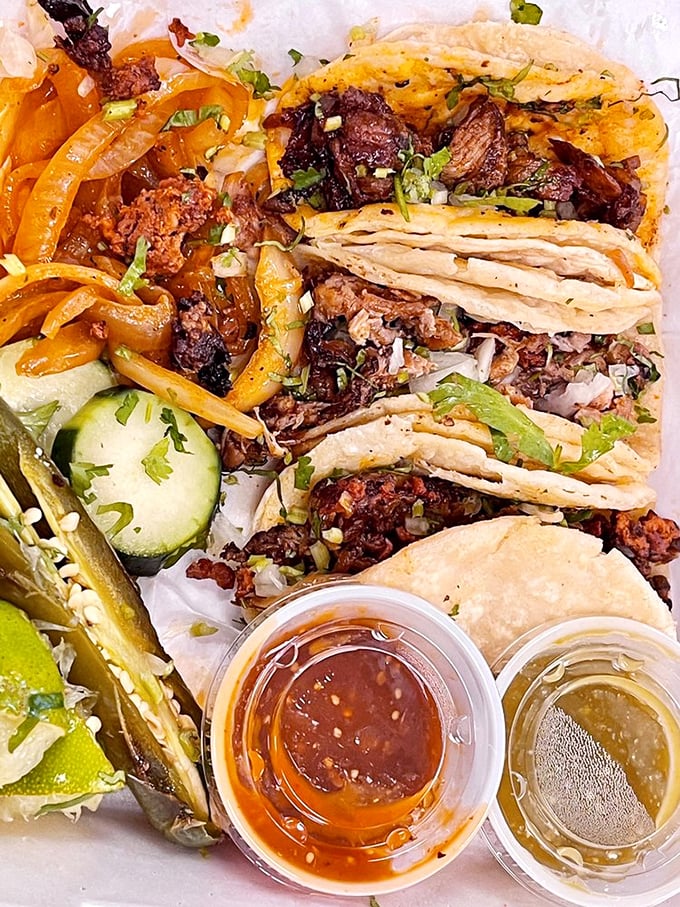 A taco lineup that deserves its own red carpet. The lime wedges aren't just for show&mdash;they're the secret handshake to flavor paradise.