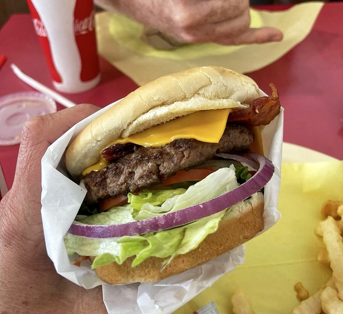 The bacon cheeseburger – where the holy trinity of beef, cheese, and bacon creates a religious experience that transcends mere hunger.