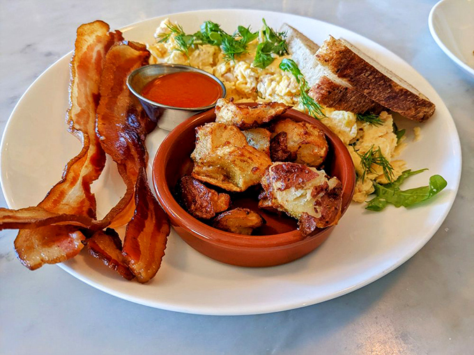 The breakfast trinity: crispy bacon, fluffy eggs, and golden potatoes. Some traditions exist because they're absolutely perfect just as they are.