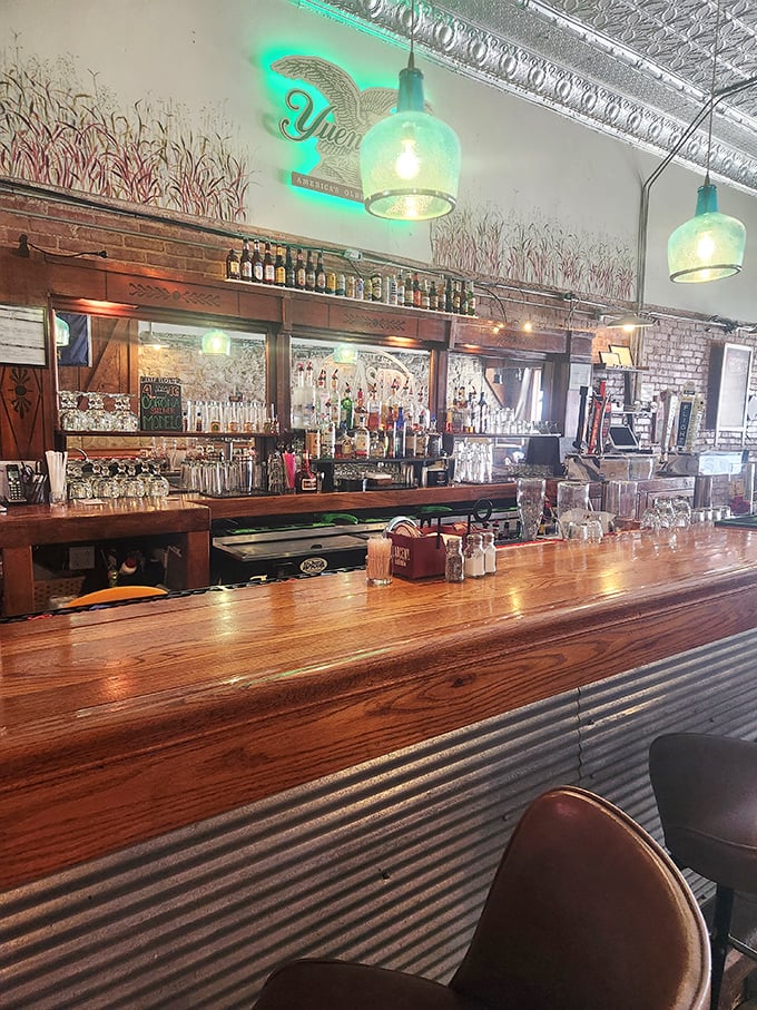 The bar at Ad Astra isn't just serving drinks—it's offering liquid history in a space where every polished wood surface gleams with possibility.