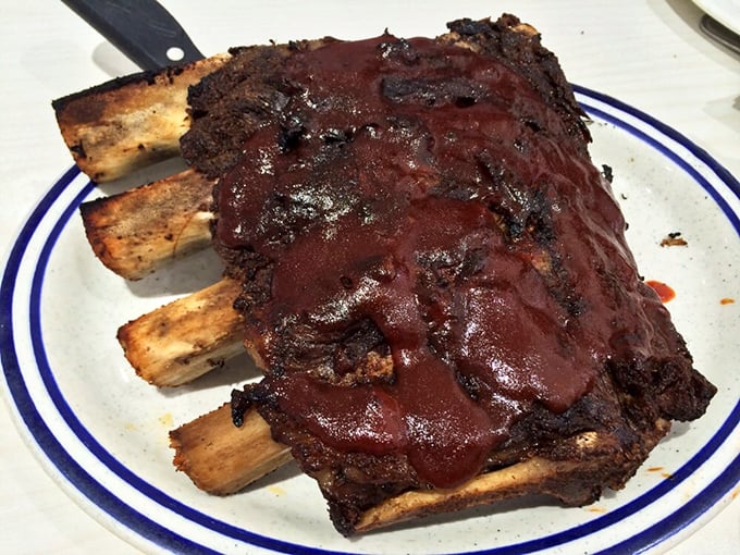 These ribs aren't just fall-off-the-bone tender—they're practically volunteering to jump onto your fork. Sauce-painted perfection.