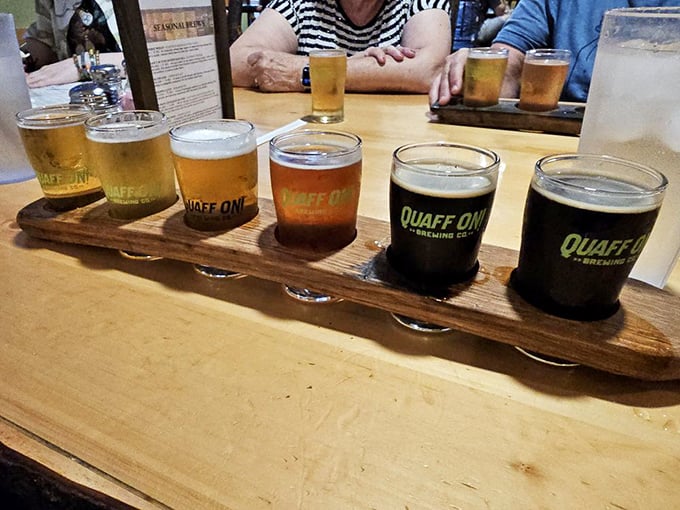 A flight of Quaff ON! beers lined up like liquid soldiers ready for duty. From golden ales to midnight stouts, there's a flavor battalion at your service.