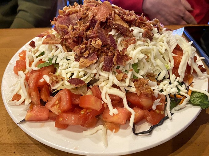 They say you don't make friends with salad, but they haven't met this beauty. Crisp vegetables, cheese, and bacon bits creating a party your mouth won't want to leave.