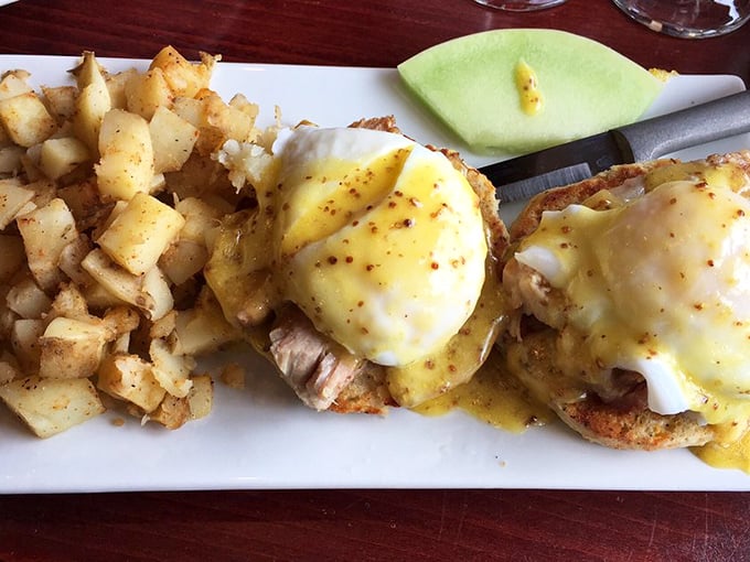 French toast that transcends the ordinary, dusted with powdered sugar like fresh Adirondack snow. The whipped butter swirl is practically begging to be Instagrammed.