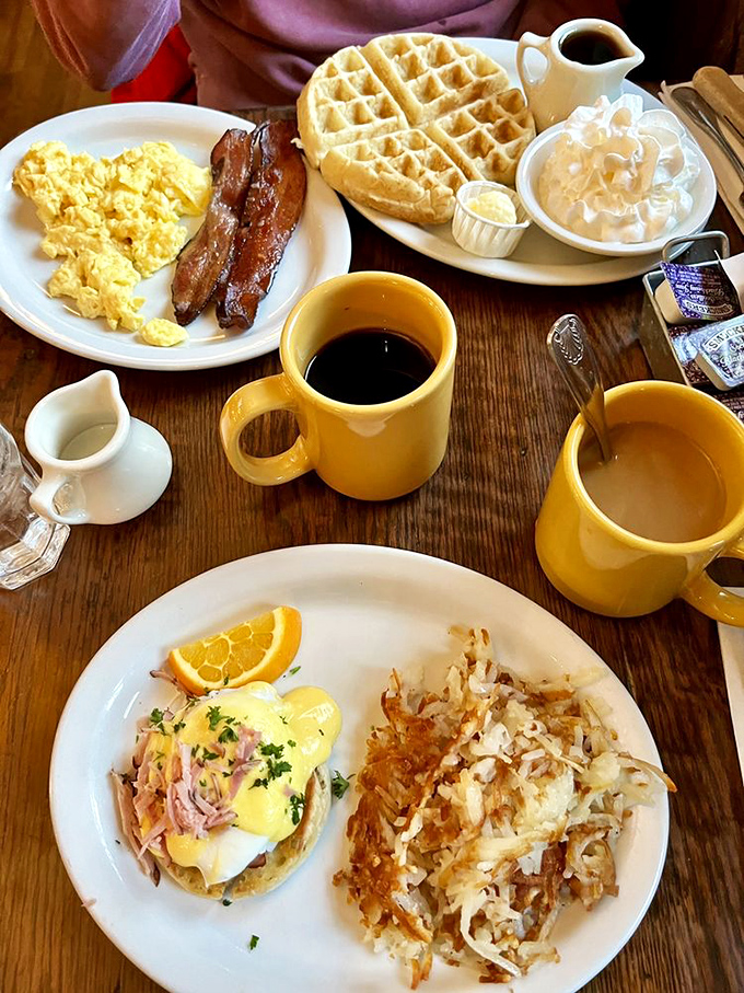 Morning glory on a wooden table &ndash; eggs, bacon, waffles, and coffee mugs the color of sunshine. This is why beds get abandoned.