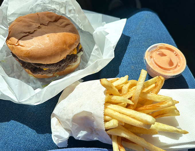 The classic combo&mdash;a perfectly proportioned burger alongside golden fries with a side of fry sauce that deserves its own fan club.