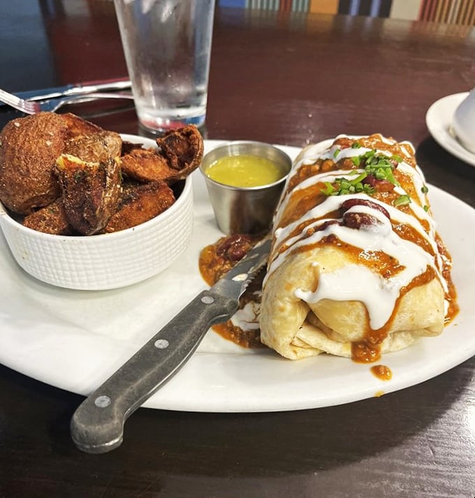 Breakfast burrito meets artistic masterpiece. When your meal requires a knife and comes with a side of crispy potatoes, you know you're in good hands.