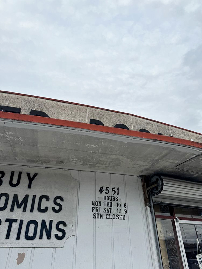 Business hours posted like a promise: six days a week to get lost in literature. Sunday is for reading your newfound treasures.