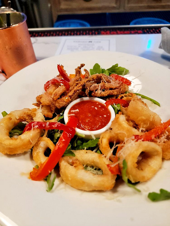 These aren't just calamari&mdash;they're golden rings of the sea, crisped to perfection. That dipping sauce isn't optional&mdash;it's the exclamation point at the end of a delicious sentence.
