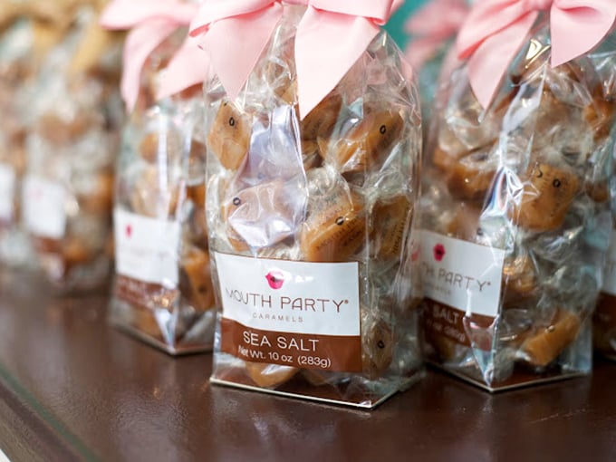 Sea salt caramels packaged with pink bows—because sometimes the perfect gift isn't jewelry but something that melts in your mouth, not in your hand.