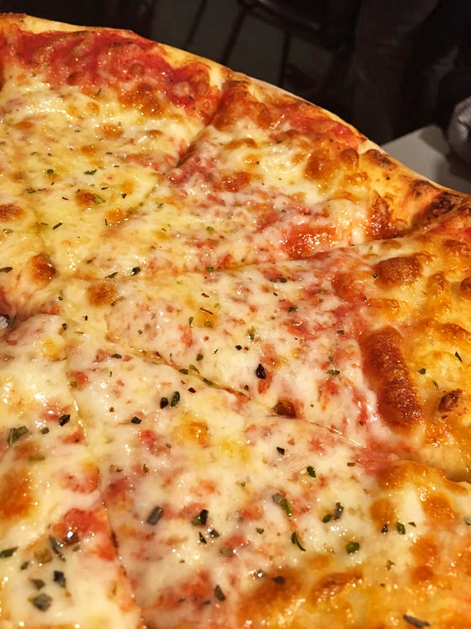 Sometimes the simplest things are the most profound. This cheese pizza is the Meryl Streep of pies—classic, reliable, and always delivering an award-worthy performance.
