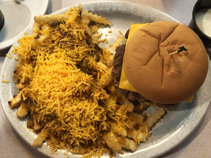 The classic American cheeseburger meets its soulmate &ndash; a mountain of cheese-covered hash browns that makes French fries seem like a distant memory.