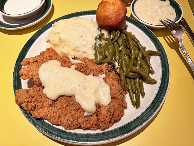 Country fried steak smothered in pepper gravy &ndash; proof that some of life's greatest pleasures come covered in breading and gravy.