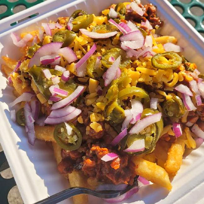 Chili cheese fries topped with jalape&ntilde;os and onions&mdash;a beautiful mess that requires both a fork and absolutely no shame. 