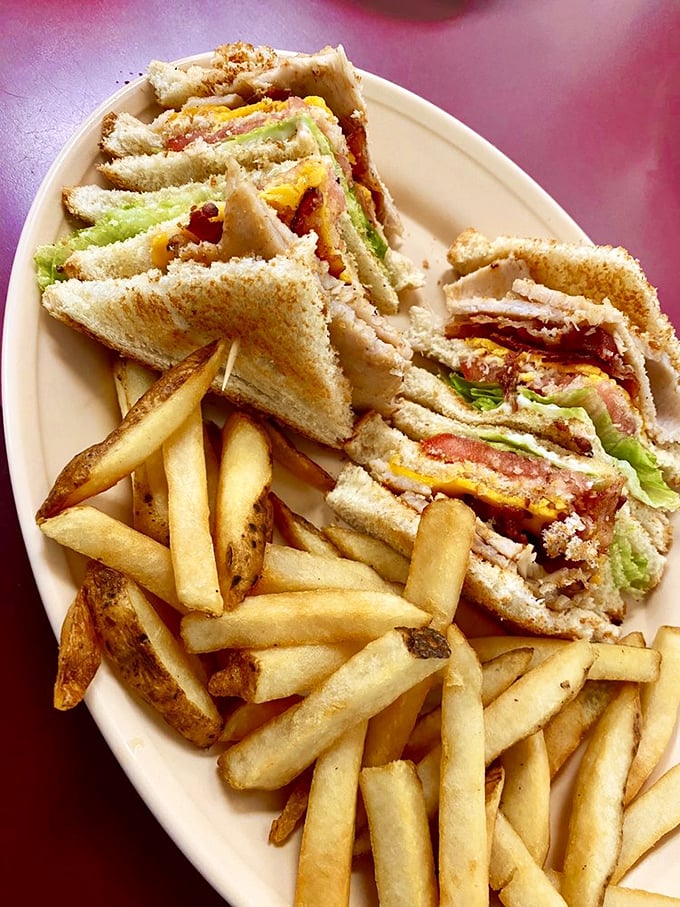 The club sandwich: three stories of deliciousness that requires jaw gymnastics to eat but rewards the effort with every perfectly balanced bite. 