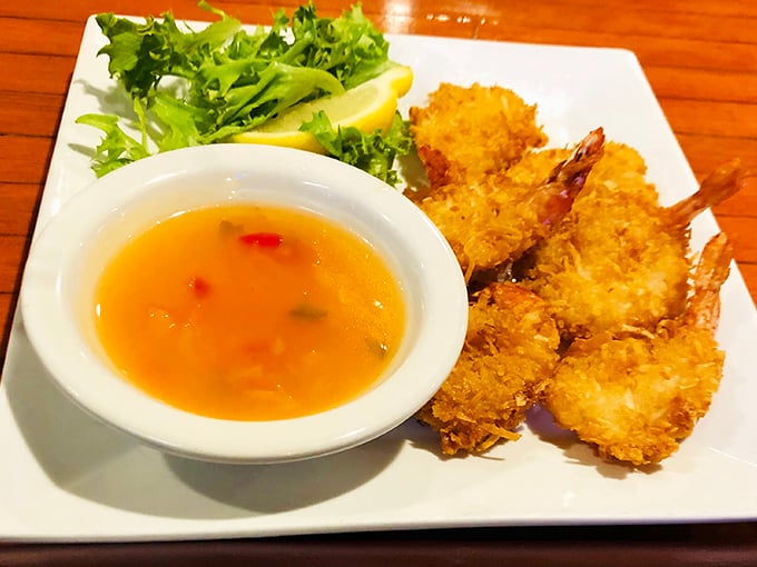 The coconut shrimp arrives flanked by a refreshing salad and broth so good you'll contemplate drinking it straight from the bowl.