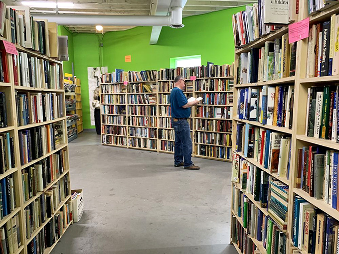The Politics section stands like a literary United Nations &ndash; diverse perspectives sharing peaceful shelf space under bright green walls.