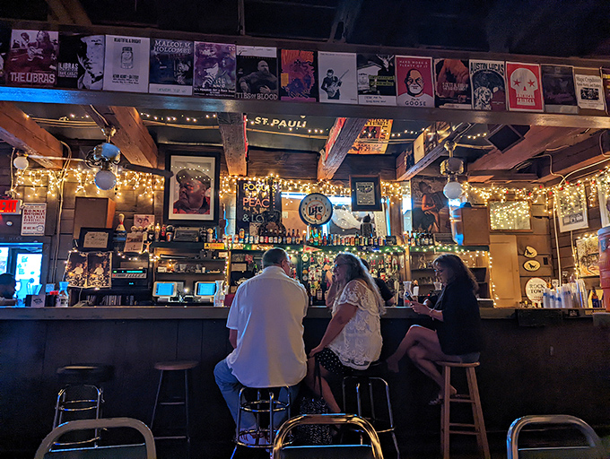 Three stools at the bar represent the holy trinity of dive bar seating: close enough to order, far enough to escape, perfect for people-watching.