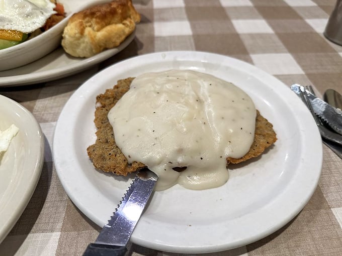 Country fried steak smothered in creamy gravy&mdash;a dish so satisfying it should come with a nap reservation.
