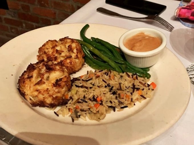Crab cakes that actually taste like crab &ndash; what a concept! Paired with wild rice that's having its own little party on the plate.