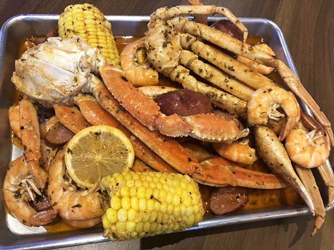 Snow crab legs, corn, potatoes, and shrimp—like a coastal summer vacation that fits on a tray instead of requiring plane tickets.