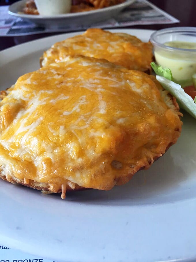 Cheese melted to molten perfection atop what appears to be crab-topped English muffins&mdash;proof that Maryland's seafood influence finds its way into everything deliciously.