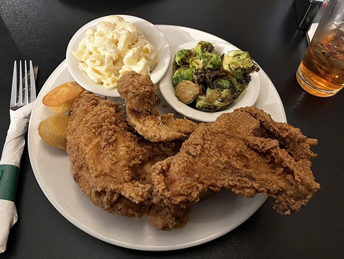 The holy trinity of Southern dining: perfectly fried chicken, collard greens with attitude, and cornbread that could make a Northerner relocate.