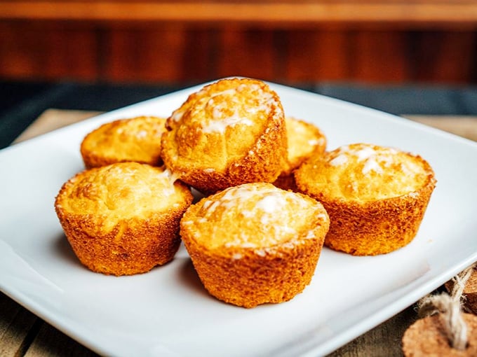 Cornbread muffins so golden and perfect they look like they're auditioning for a food commercial. Butter them while they're hot!