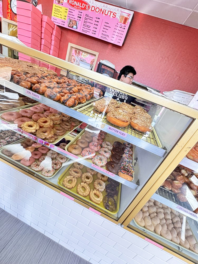 The glass case of temptation – where willpower goes to die and "I'll just have one" becomes the day's first broken promise.