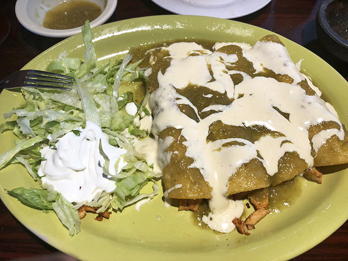 These enchiladas swim in a sea of verde sauce like Olympic athletes who've trained their whole lives for this moment on your plate.