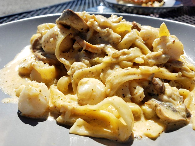 This isn't just pasta&mdash;it's a seafood symphony where every strand of fettuccine conducts creamy sauce to plump seafood. Fork-twirling has never felt so rewarding.