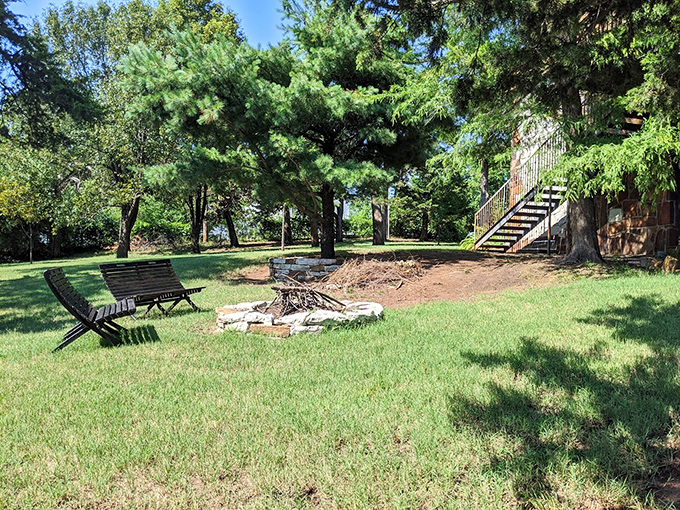 Simple wooden benches around a stone fire pit&mdash;where summer evenings turn into starlit conversations and s'more competitions.