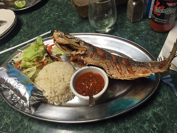 The fish is scored so beautifully it looks like it's been given gills just to show off its perfect cooking technique.