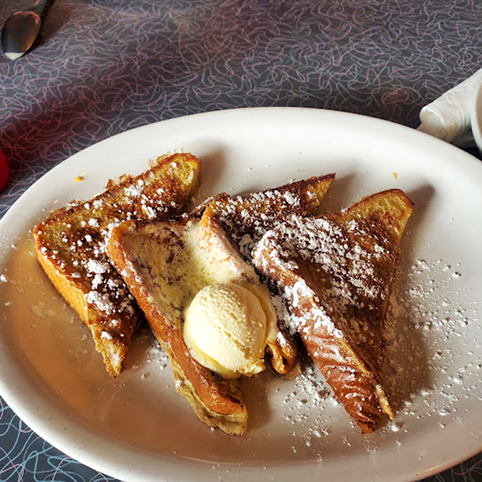 French toast that's dressed for success with powdered sugar snow and a butter hat. Breakfast or dessert? Why choose?