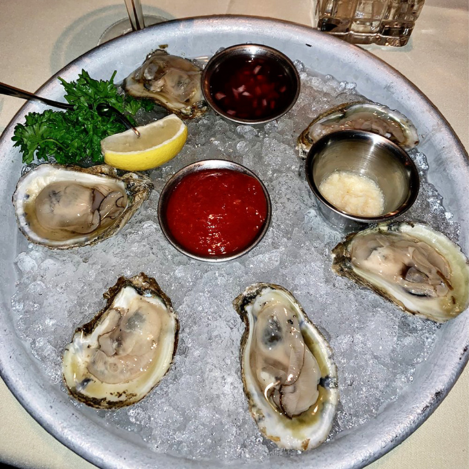 These oysters, nestled in ice like precious jewels, offer a briny taste of the ocean that's worth every mile of their journey inland.