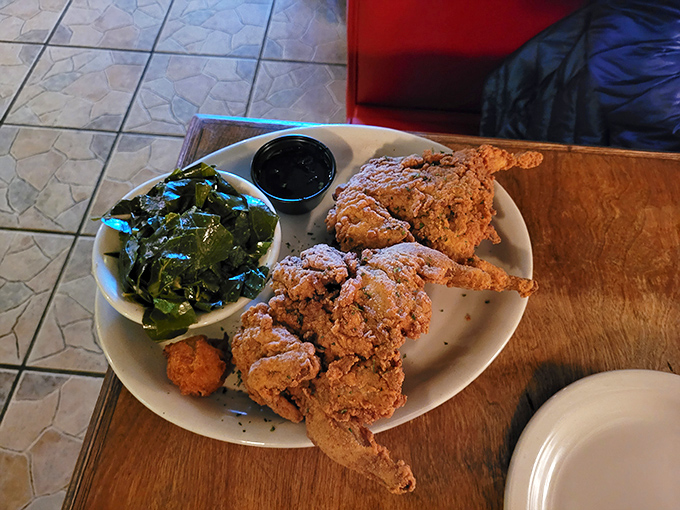 Fried chicken that would make your grandmother both jealous and proud. Paired with those collards, it's a Southern symphony on a simple white plate.