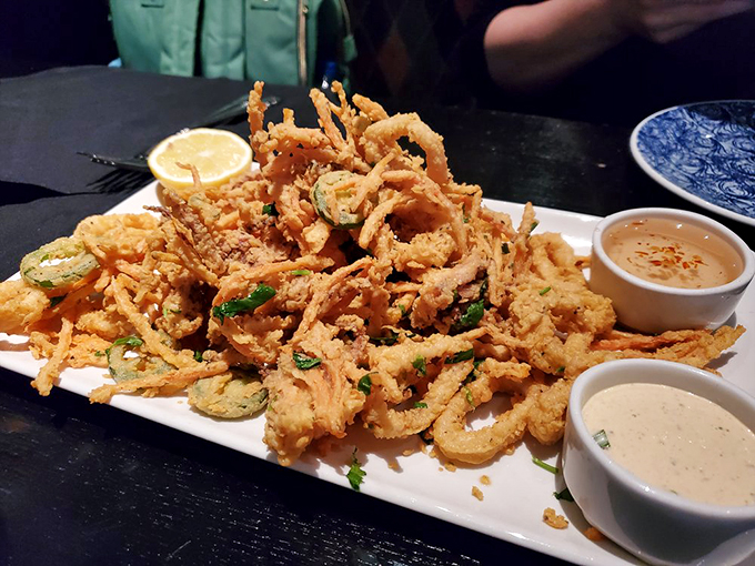 The star of the show arrives on a blue-rimmed plate: fried clams and calamari with three dipping options because important decisions should never be rushed.