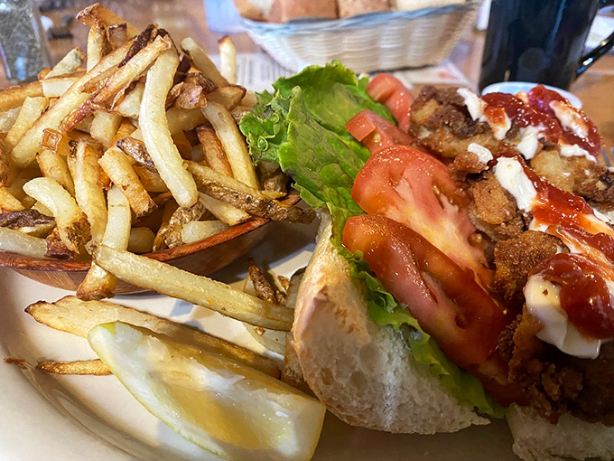 This sandwich isn't just lunch&mdash;it's architecture. Crispy fish, fresh toppings, and fries that could start their own fan club.