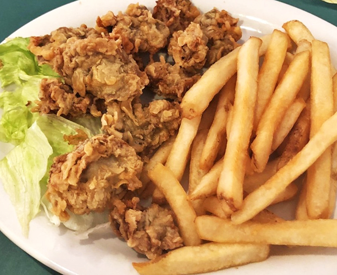 Golden-fried chicken strips and fries&mdash;simple perfection that proves sometimes the most straightforward dishes deliver the most satisfaction.