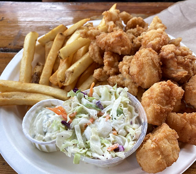 Crispy fried goodness that makes you wonder why you ever eat anything else. The holy trinity of seafood dining: golden scallops, fresh-cut fries, and house-made coleslaw.
