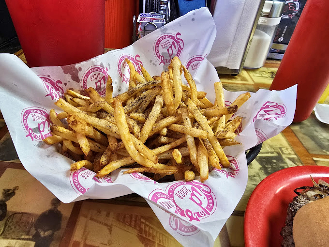 These aren't just fries&mdash;they're golden happiness sticks, served in paper-lined baskets with enough seasoning to make your taste buds stand at attention.