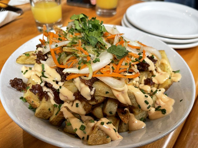 These aren't just breakfast potatoes&mdash;they're a canvas for culinary creativity, topped with a confetti of ingredients and a sauce that demands to be dragged through.