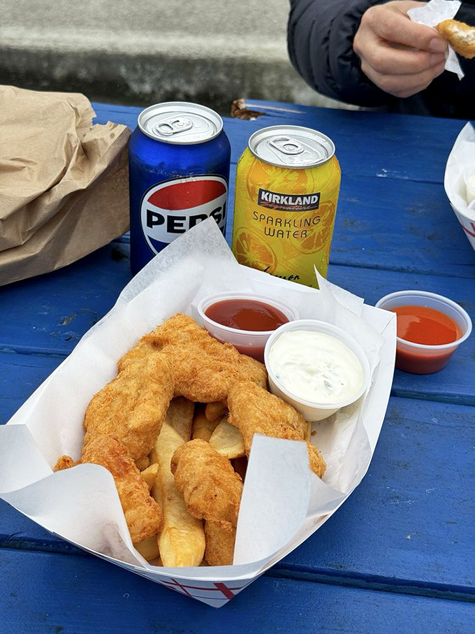 Car dining at its finest. The paper boat might be humble, but what it carries is pure coastal gold.