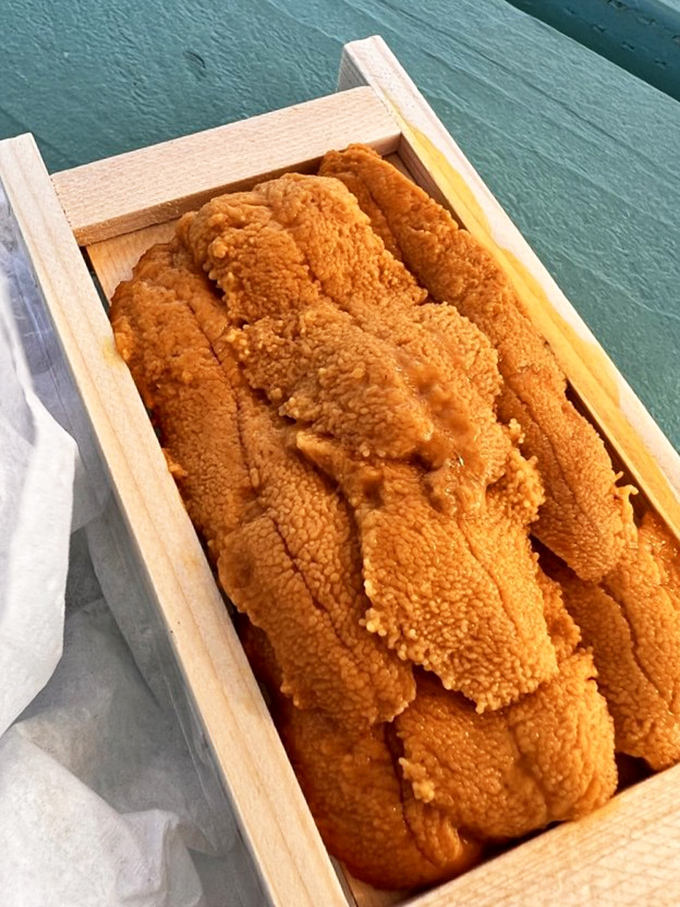 Golden treasures in a wooden box. Like opening a pirate's chest, only instead of doubloons, you've discovered something infinitely more valuable&mdash;fresh uni.