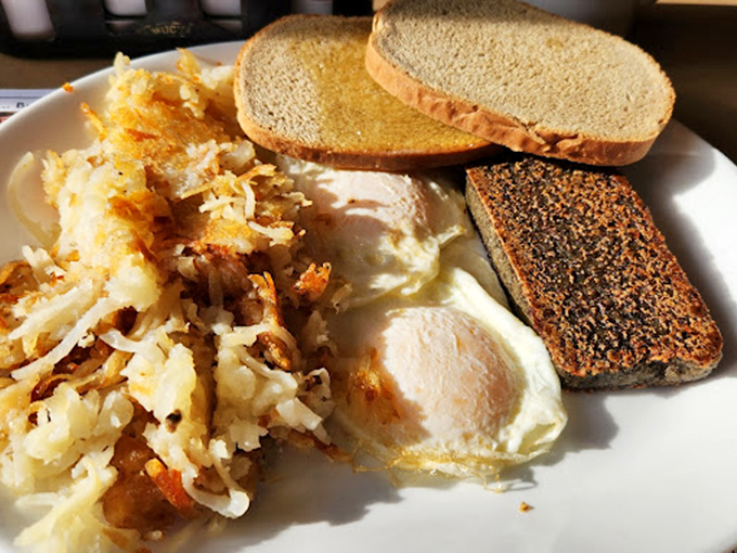 A breakfast trinity that would make any morning person weep with joy&mdash;crispy hash browns, perfectly cooked eggs, and toast ready for butter baptism.
