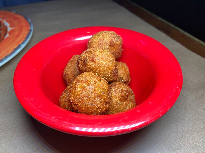 Golden orbs of deep-fried perfection. These hushpuppies aren't telling secrets, but they might make you involuntarily moan with delight.