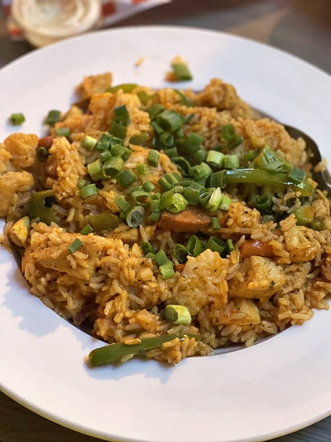 Their jambalaya is a spicy rice symphony where each grain carries the flavor parade of chicken, sausage, and vegetables. Pure comfort by the forkful.