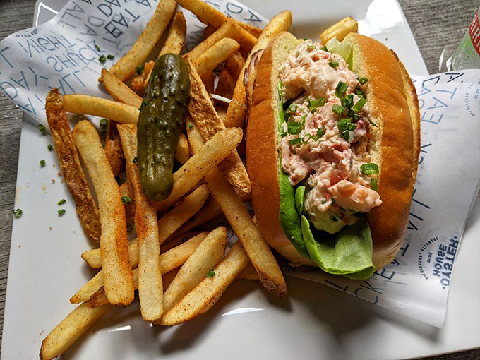 The classic Maine-style lobster roll, where simplicity reigns supreme. Lettuce and mayo play supporting roles to the true star—sweet, tender lobster meat.